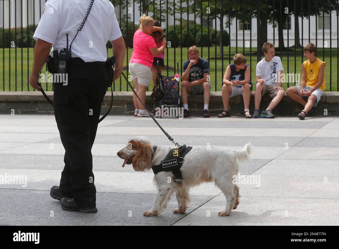 A Uniformed Division Secret Service police officer patrols with a dog ...