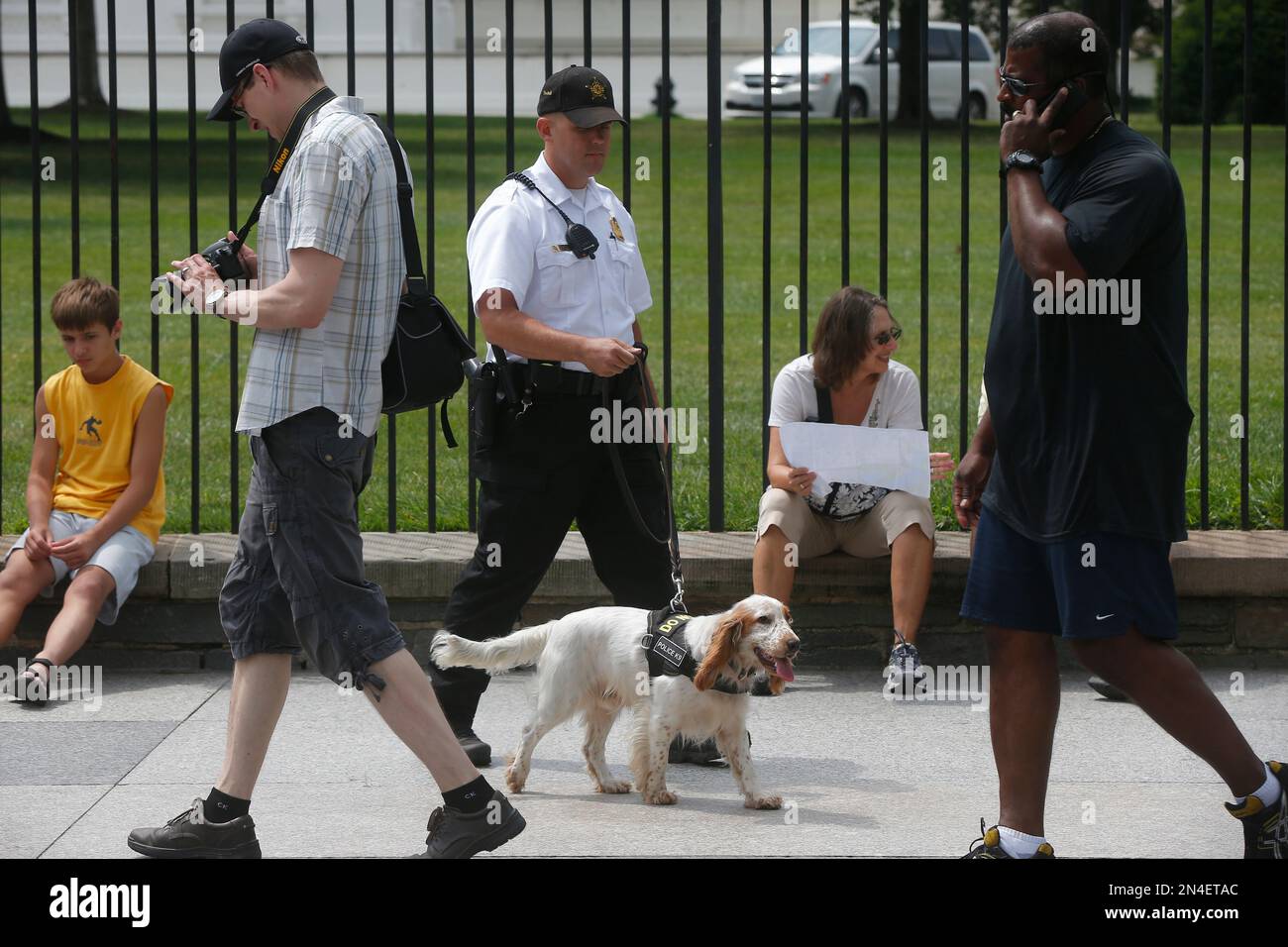 A Uniformed Division Secret Service police officer patrols with a dog ...