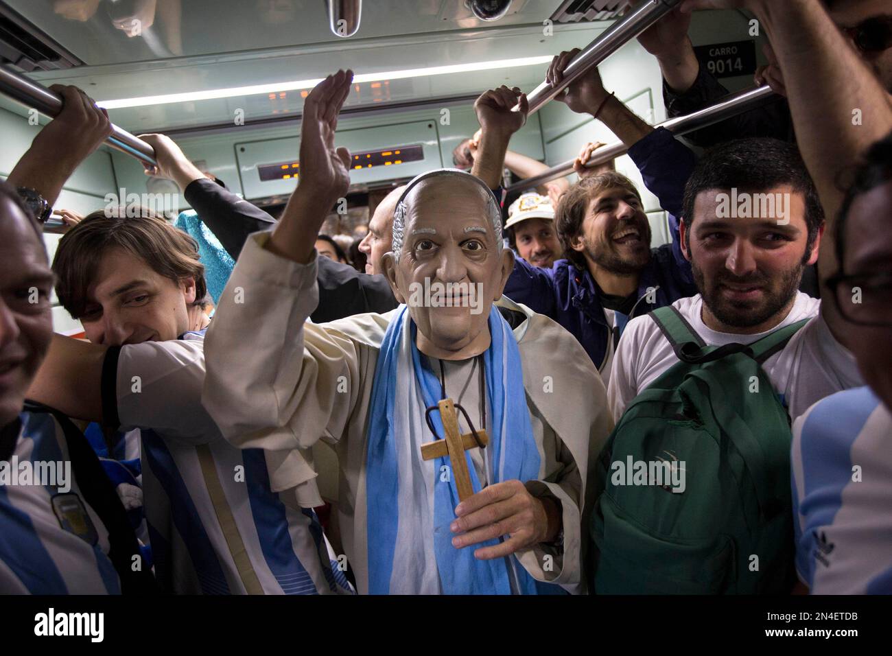 A man dressed as Pope Francis cheers with others Argentina national ...