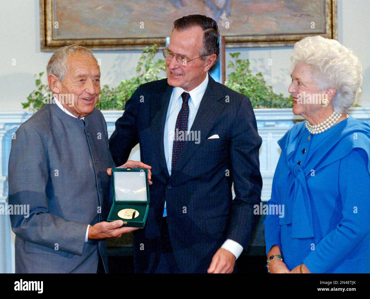 President George Bush and first lady Barbara Bush present the ...