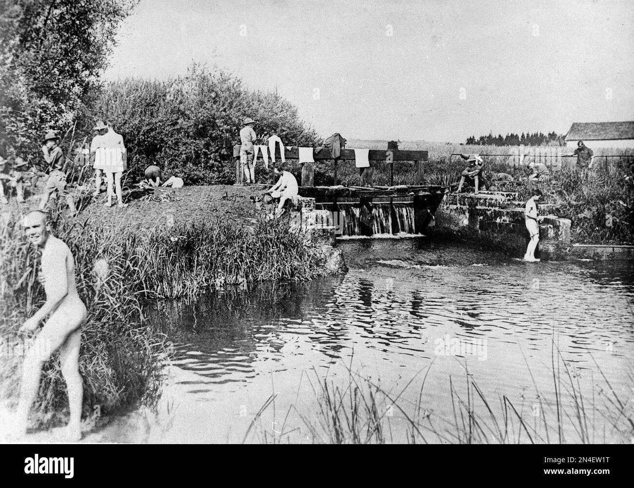 U.S. soldiers bath and swim in the cool water during World War I. Date ...