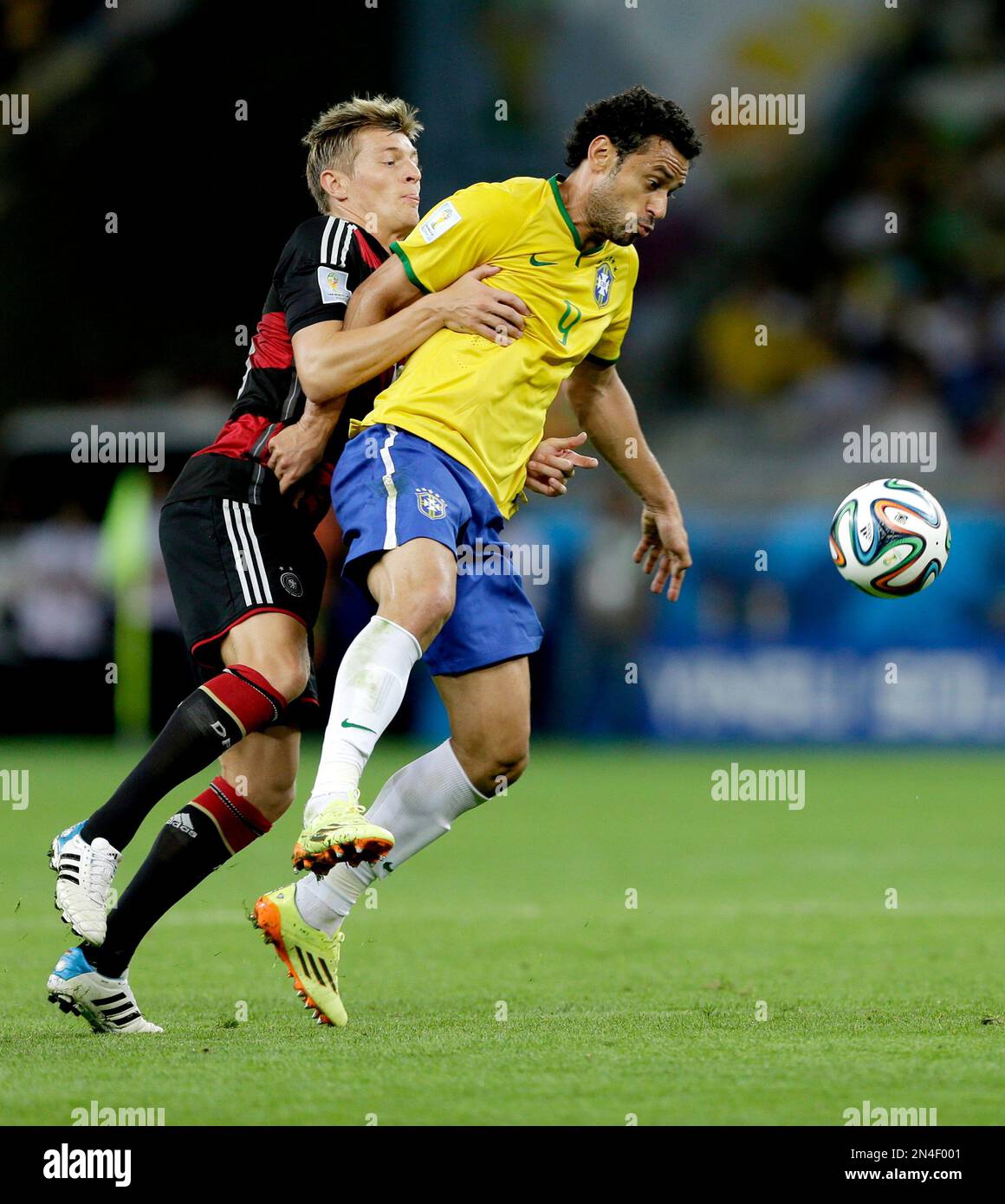 Germany's Toni Kroos, left, holds Brazil's Fred during the World Cup ...