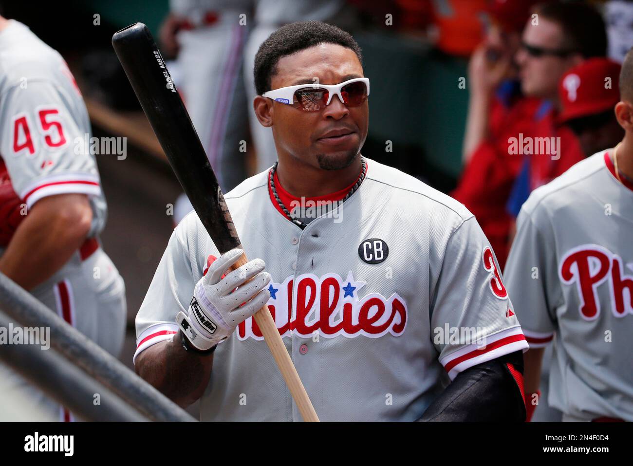 Philadelphia Phillies' Marlon Byrd warms up in the dugout before a ...