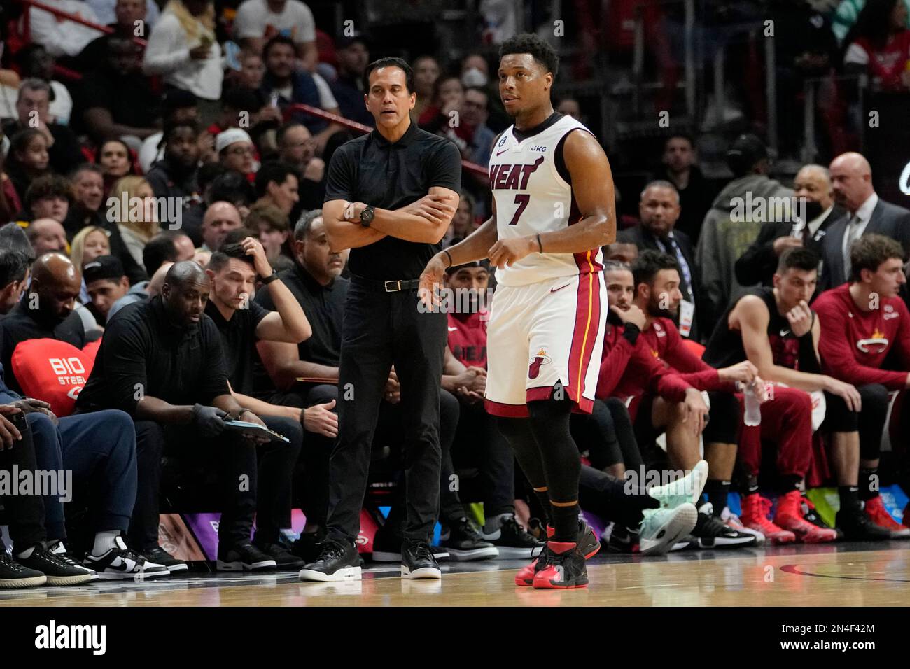 Miami Heat head coach Erik Spoelstra, left, talks with guard Kyle Lowry ...