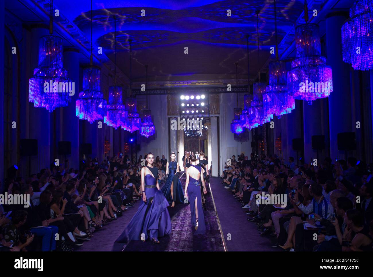 Models present creations by Italian fashion designer Donatella Versace ...