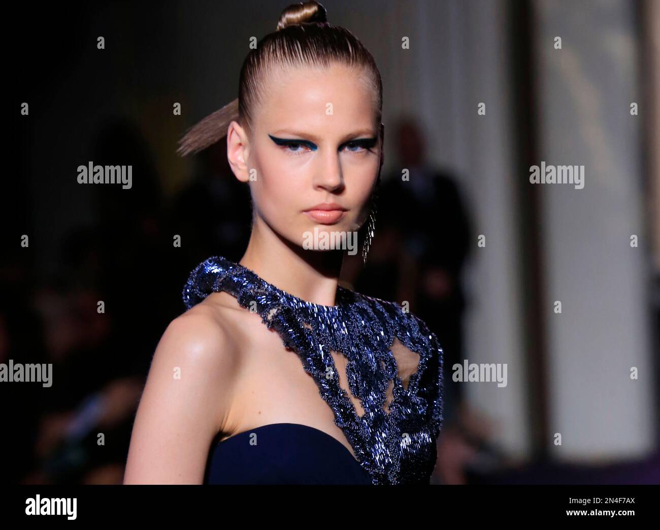 A model presents a creation by Italian fashion designer Donatella ...