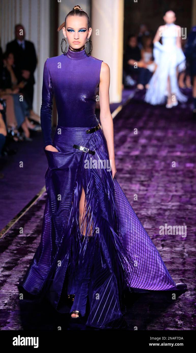 A model presents a creation by Italian fashion designer Donatella ...