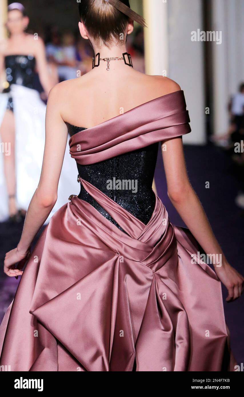 A model presents a creation by Italian fashion designer Donatella ...