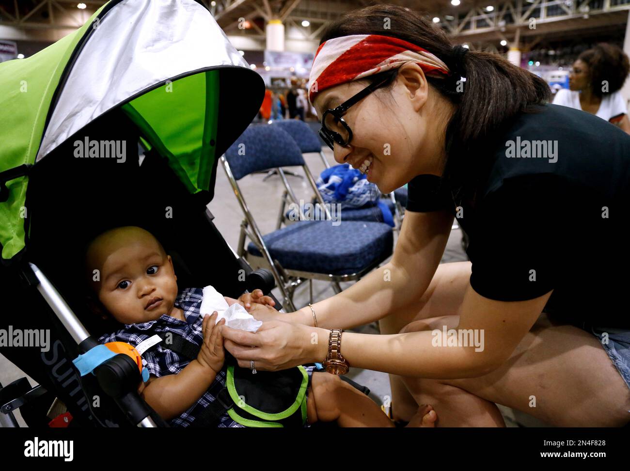 Rui Claiborne uses a Bounty paper towel with her son Noah during ...