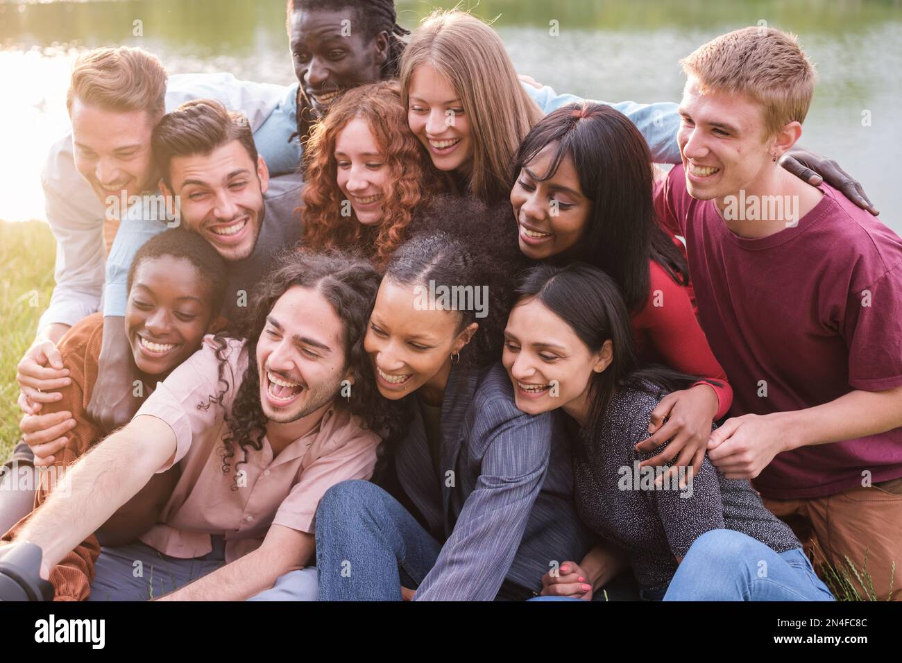 Group of young friends from different origins taking a selfie together ...