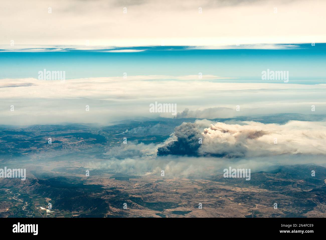 Aerial view of a big column of smoke from forest fire in southern Chile ...