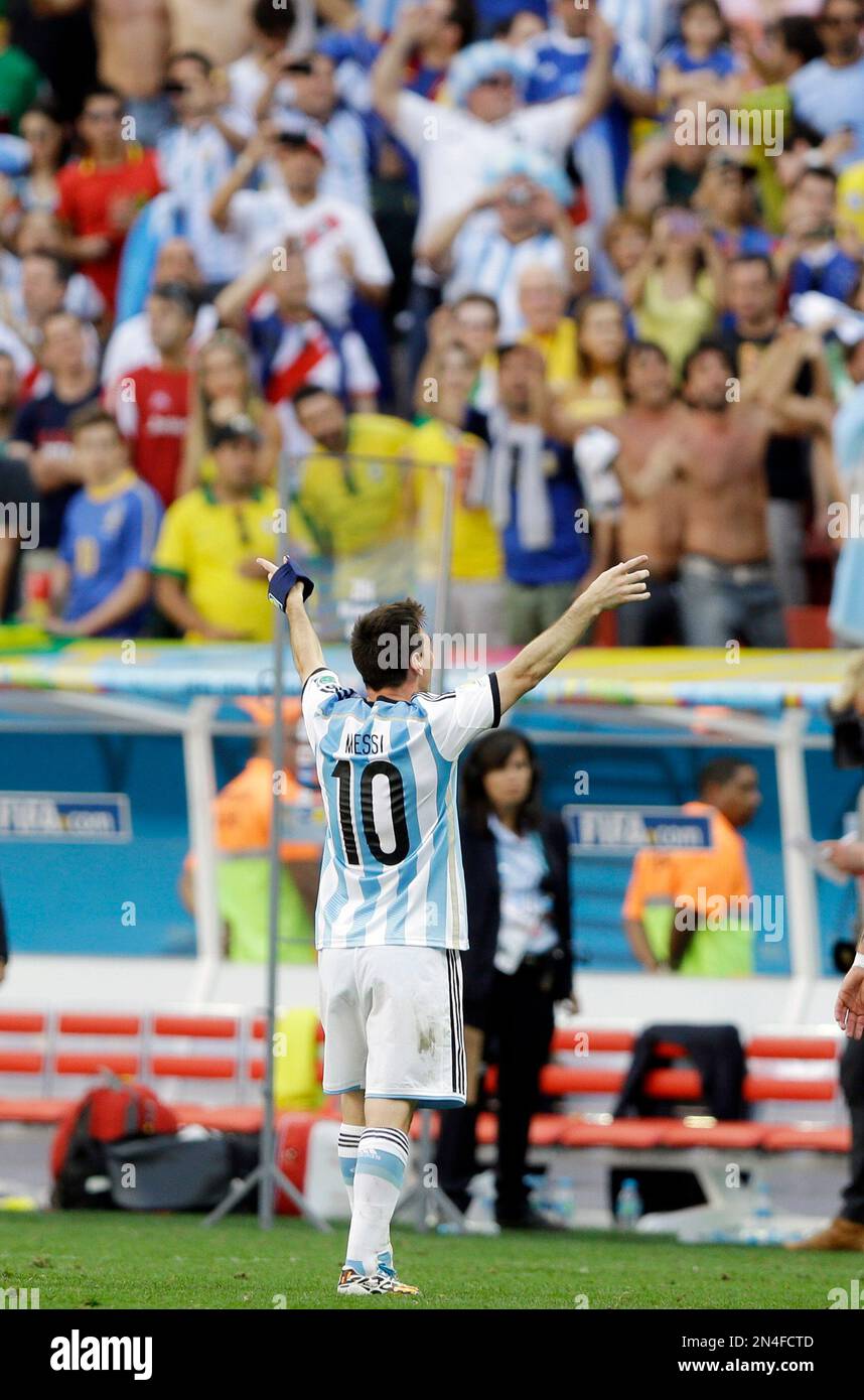 Argentina's Lionel Messi waves to spectators as walks off the pitch ...