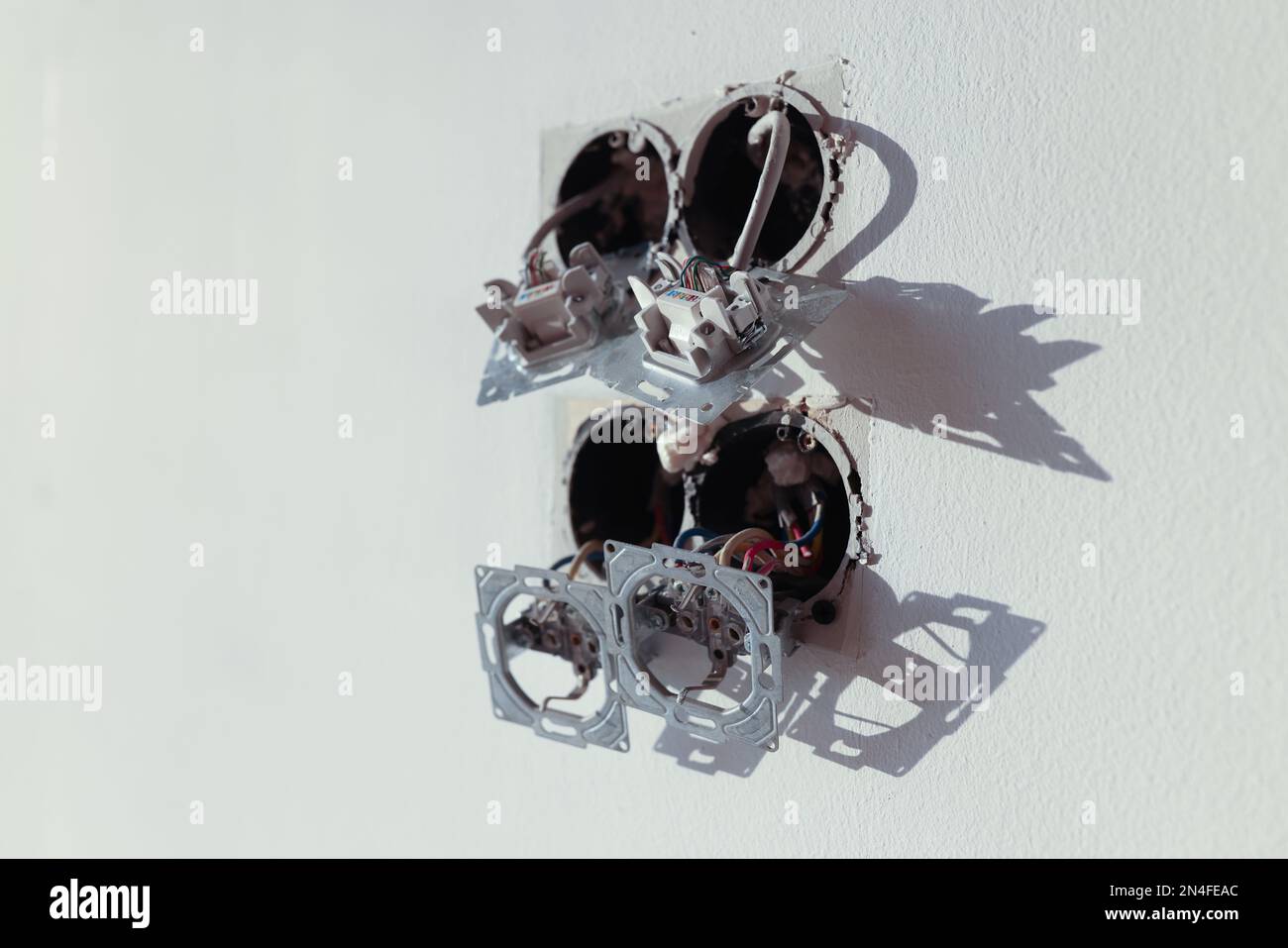 Changing wall electric socket and installing new AC power line Stock ...