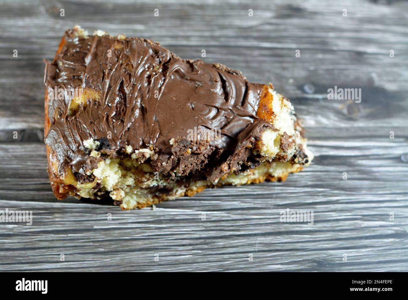 baked dough covered with chocolate and stuffed with pieces of chocolate ...