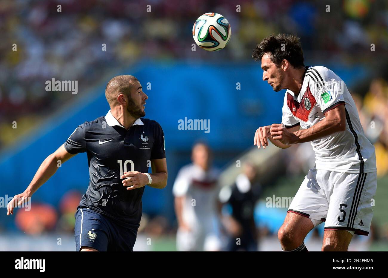 Germany's Mats Hummels, right, clears from France's Karim Benzema ...