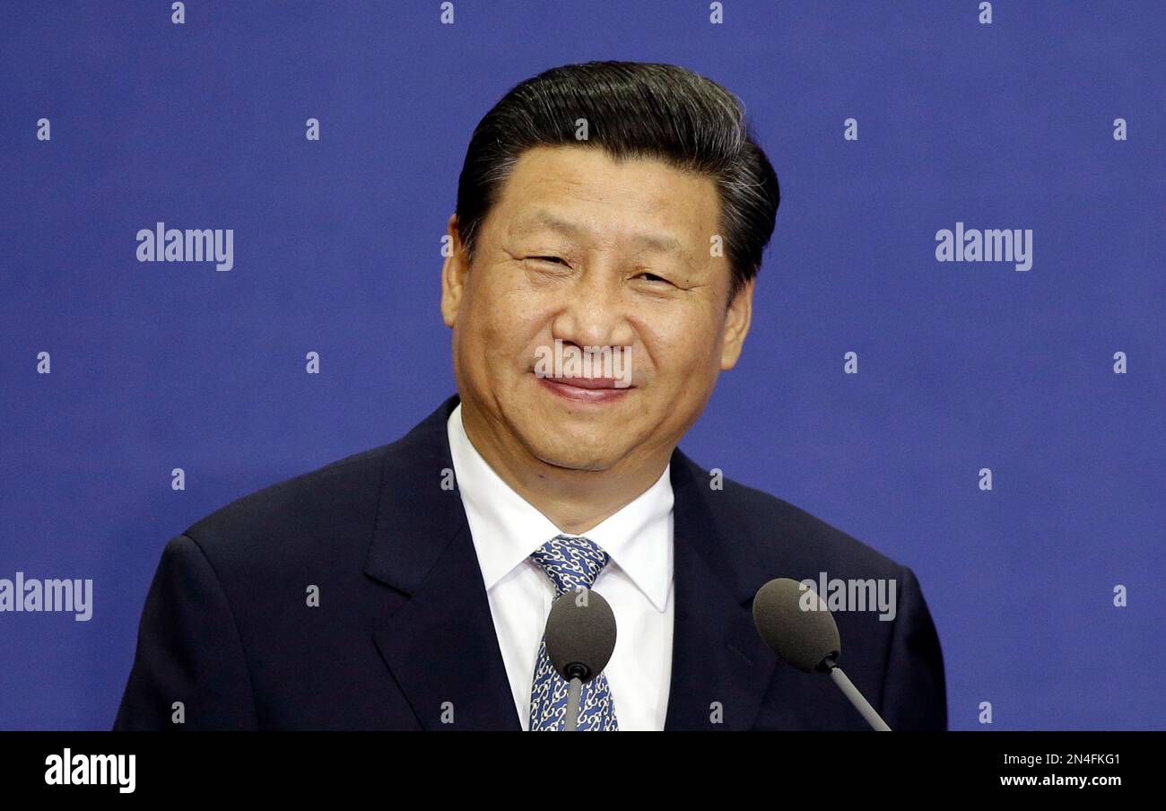 Chinese President Xi Jinping smiles as he delivers a speech to students ...