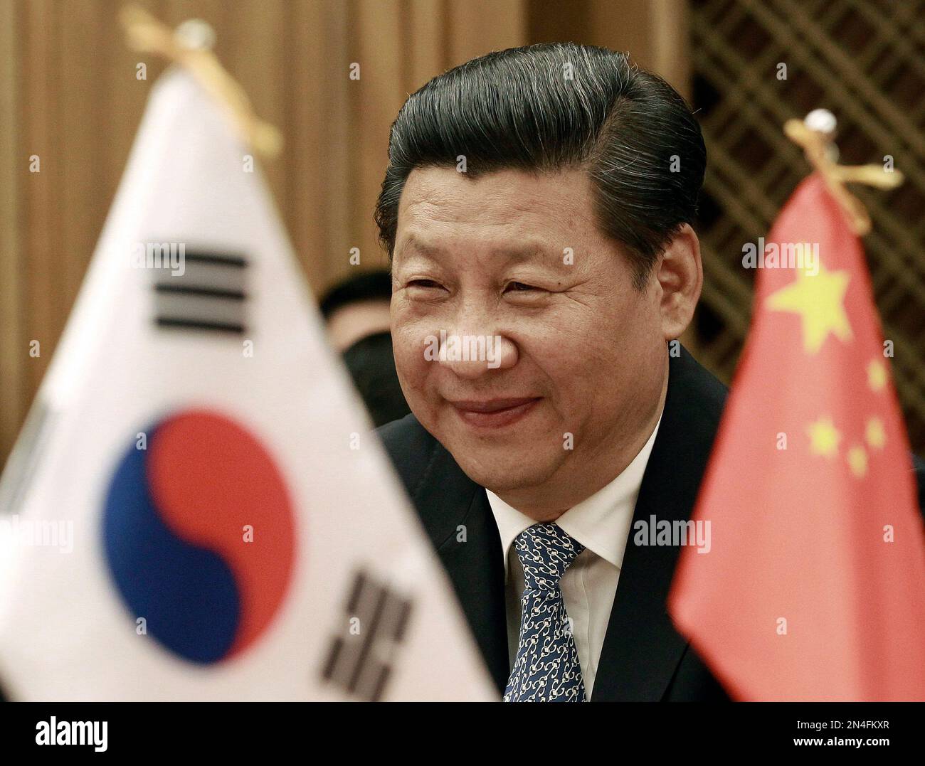 Chinese President Xi Jinping smiles during a meeting with South Korean ...