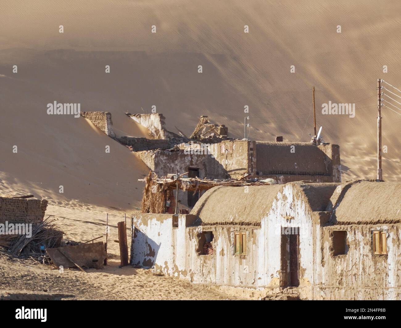 An old destroyed house buried in the desert in the dunes of Egypt Stock ...