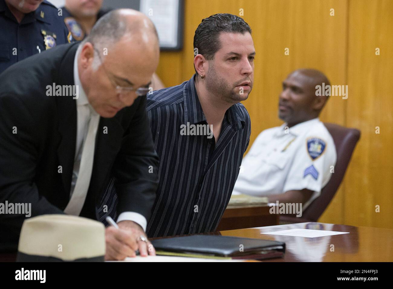 Brandon Taylor, center, attends his arraignment at Manhattan Supreme ...