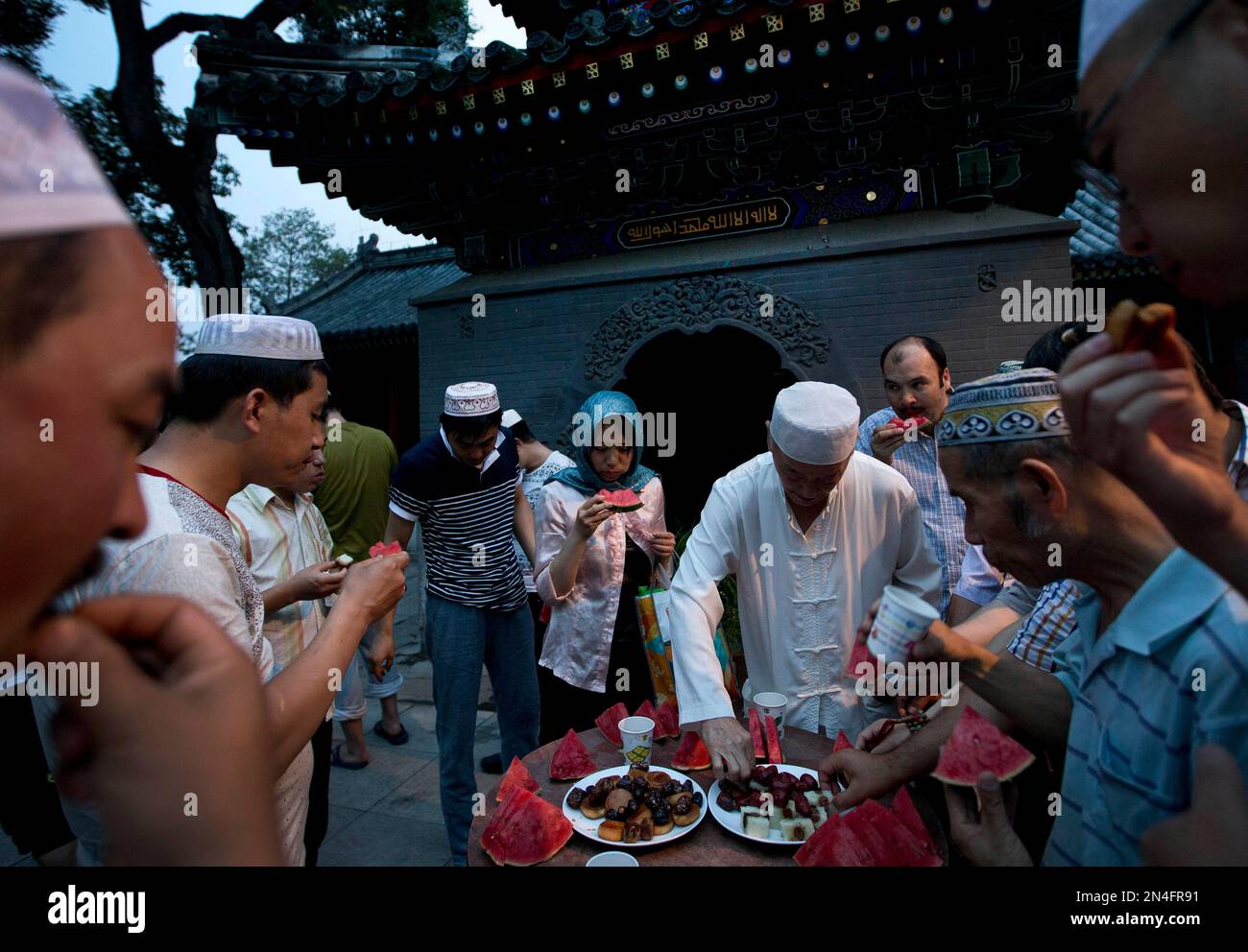 Chinese Muslims gather to break their fast during the Muslim holy month ...