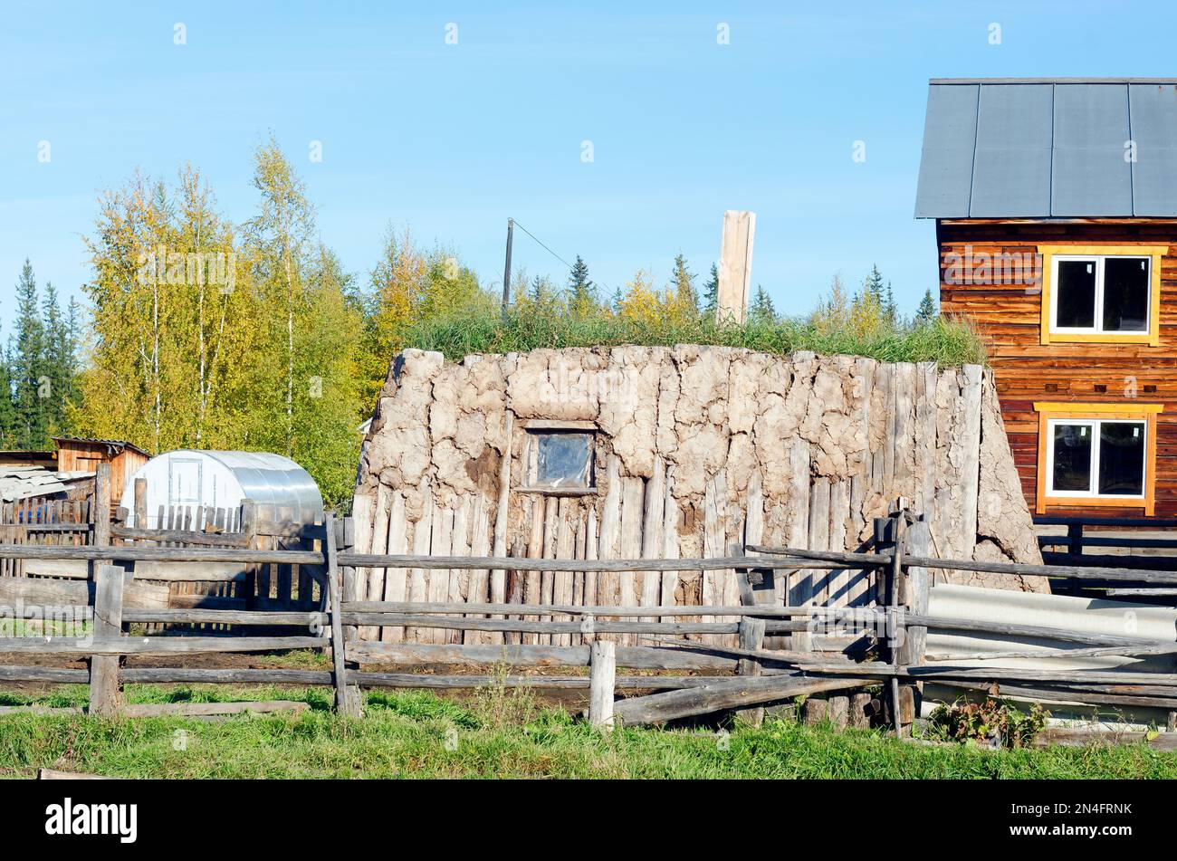 The room for cattle hoton, made of cow dung and wood, overgrown with ...