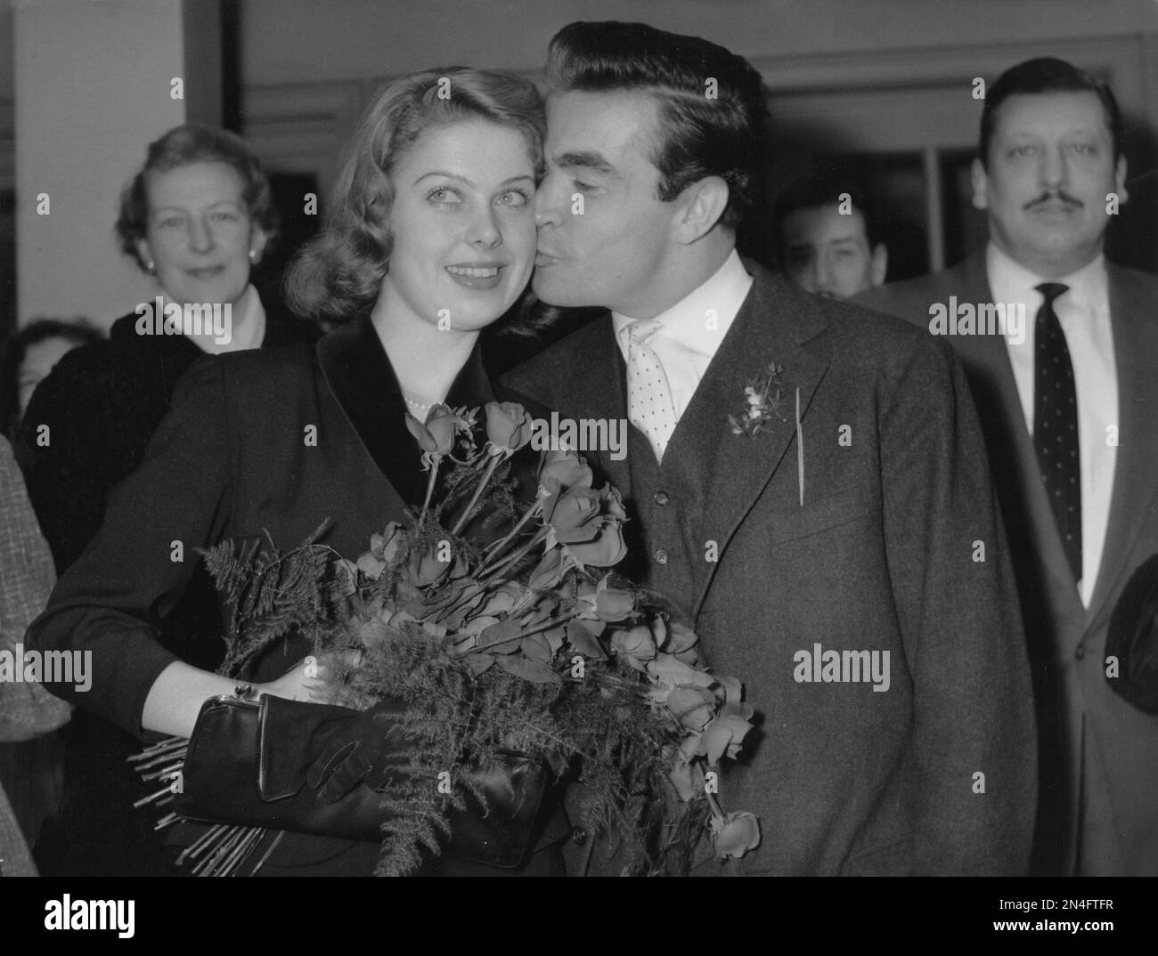 German actor Claus Biederstaedt kisses his wife, Ingrid Peters, a 19 ...