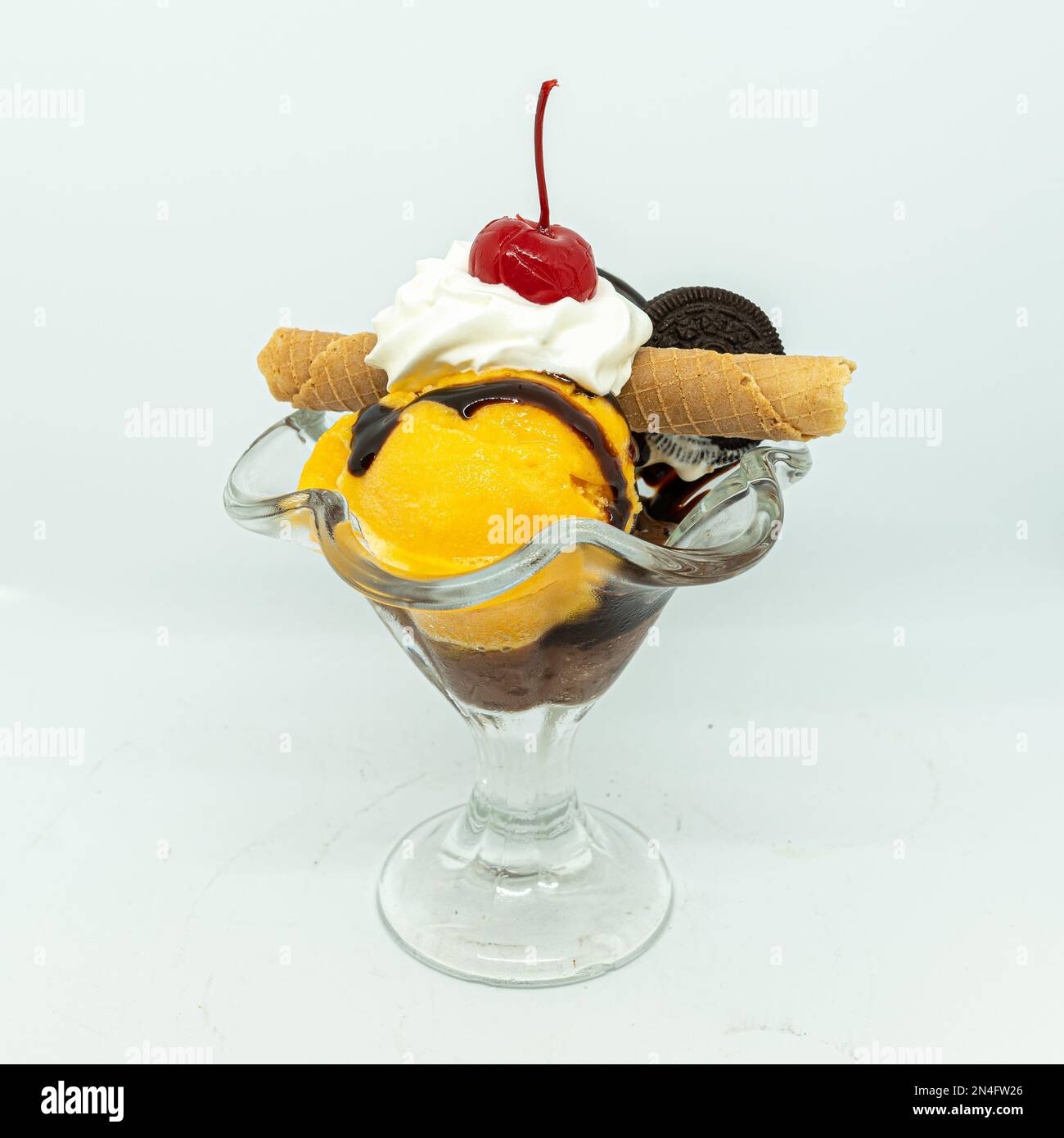 A gourmet delicious ice cream sundae isolated on a white background ...