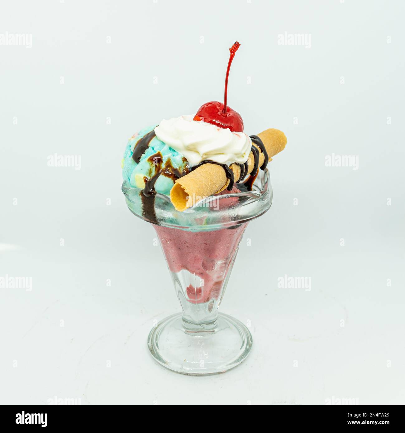 A gourmet delicious ice cream sundae isolated on a white background ...