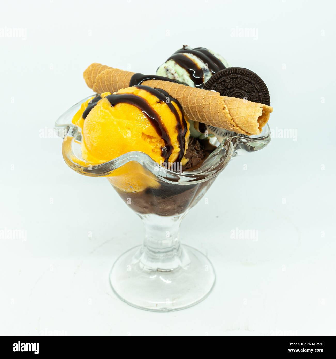 A gourmet delicious ice cream sundae isolated on a white background ...