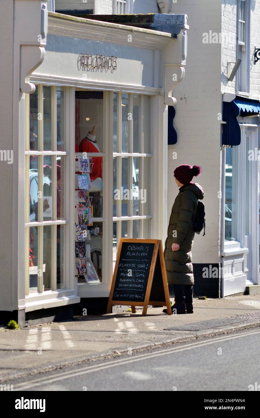 woman looking into shop window aldeburgh suffolk england Stock Photo ...