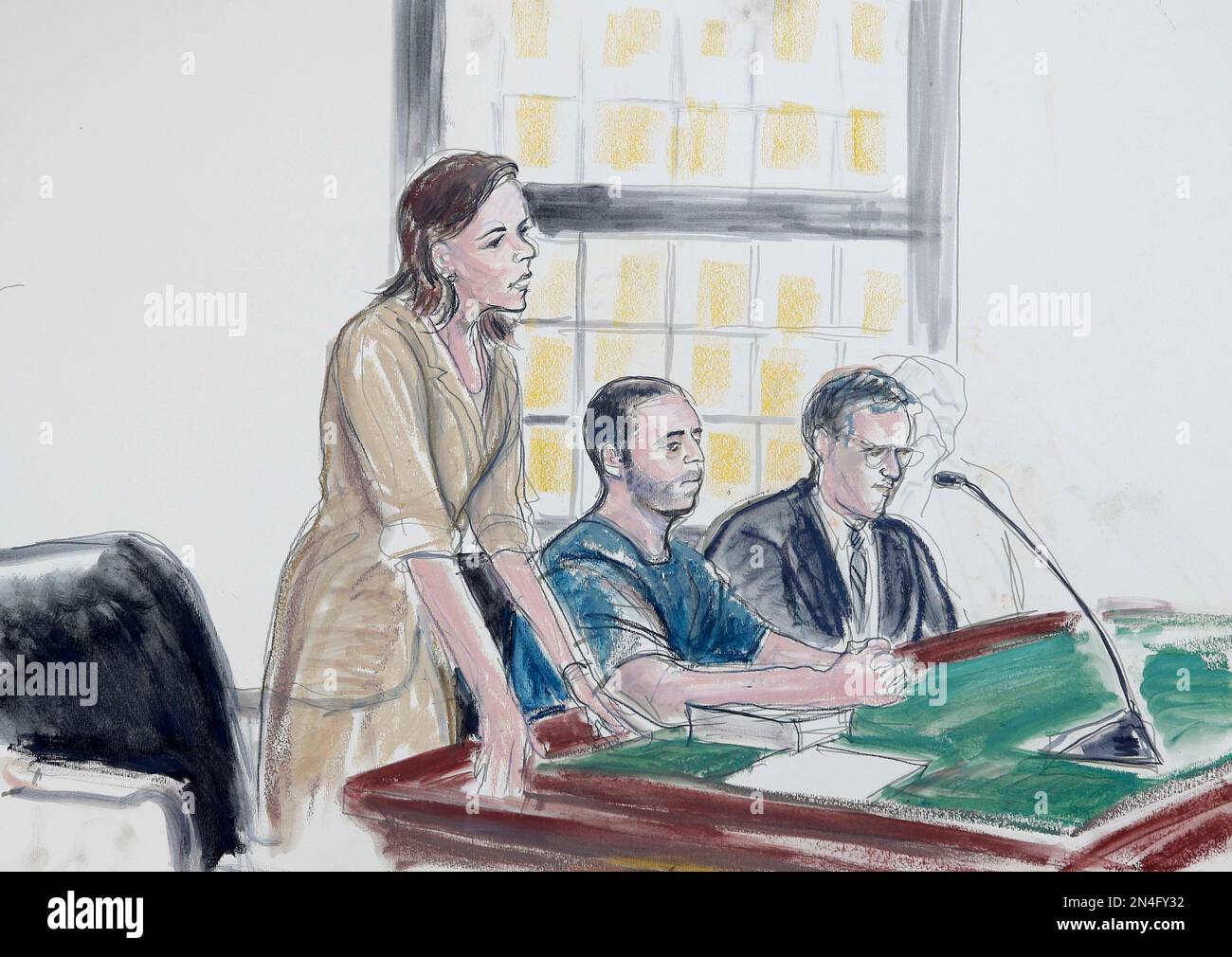 In this courtroom sketch, GIlberto Valle, center, sits with his ...