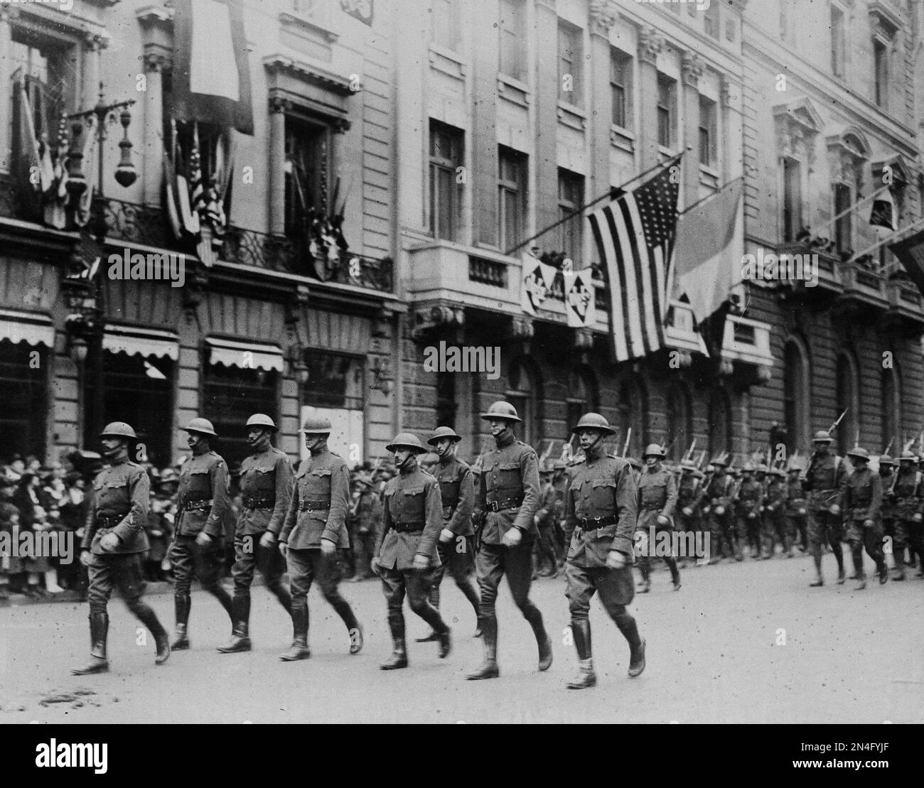 U.S. soldiers march in a homecoming parade at the end of World War I in ...