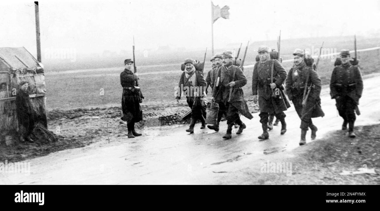 French soldiers are shown bound for the front line trenches in Flanders ...
