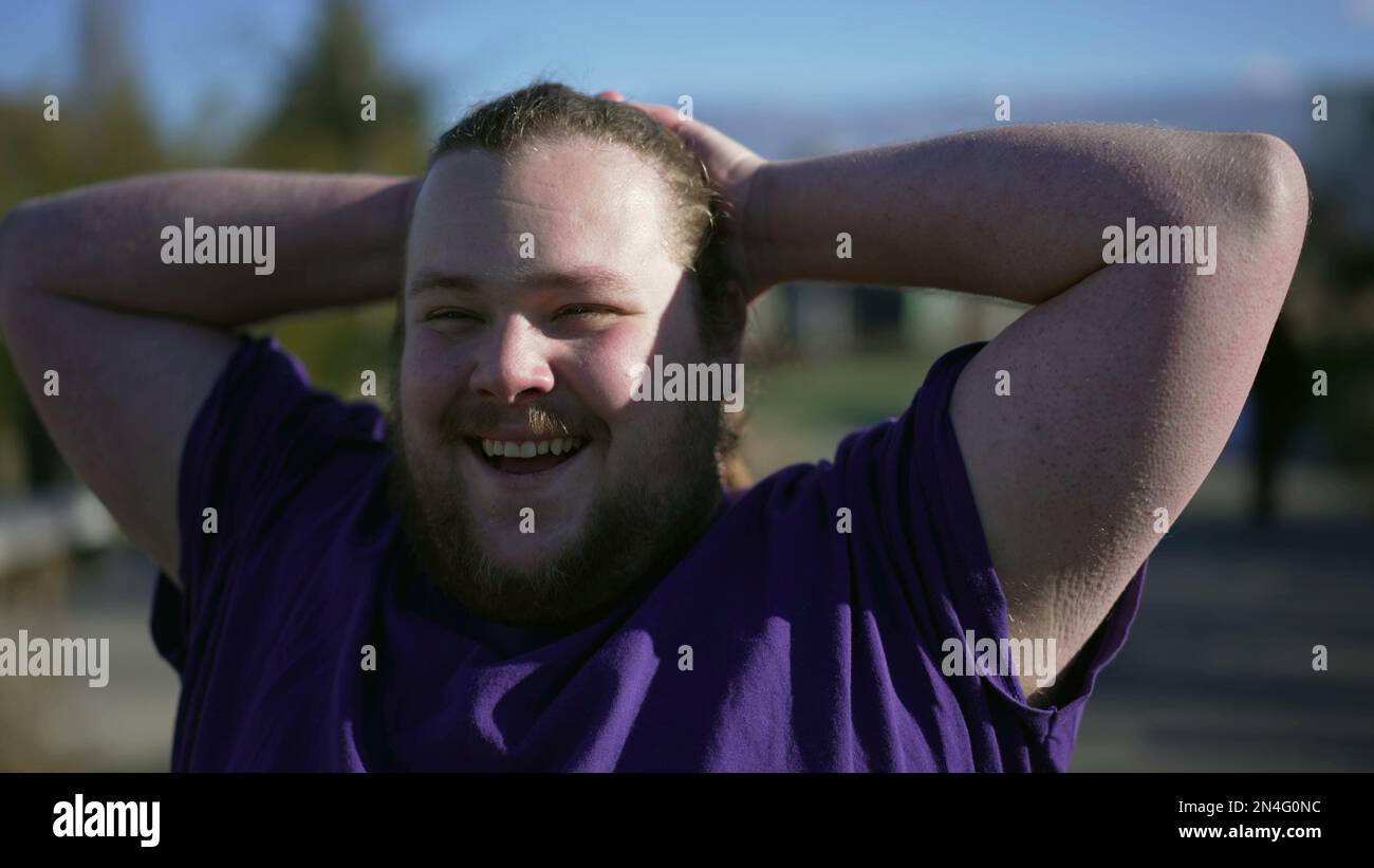One ecstatic overweight man feeling joy raising arms in the air. Happy ...