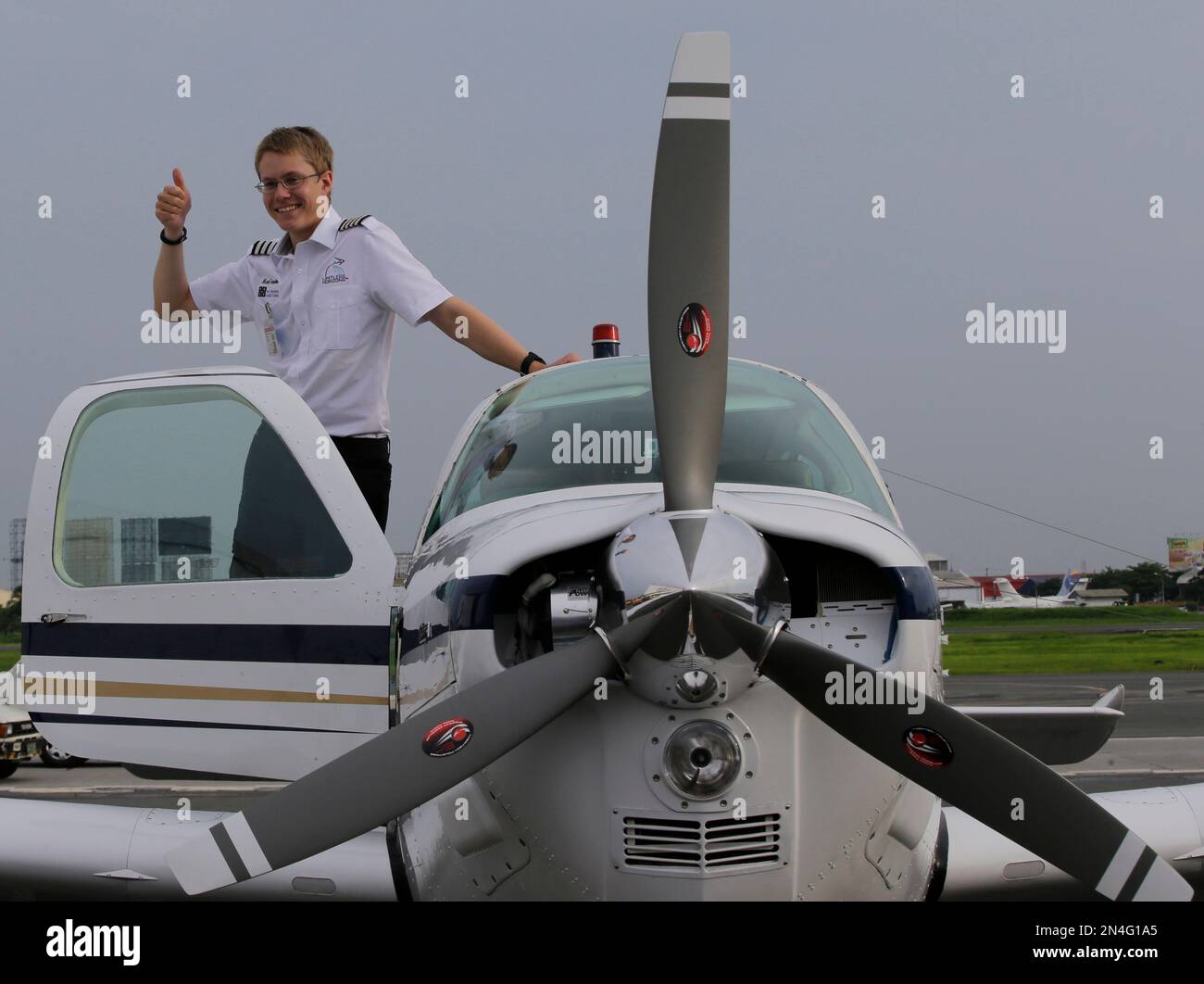 Young American pilot Matt Guthmiller, from Aberdeen, S.D., waves from ...