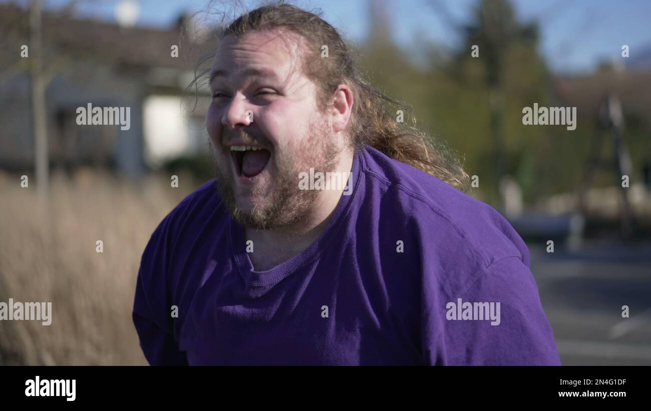One happy overweight man walking forward outdoors smiling. A joyful fat ...