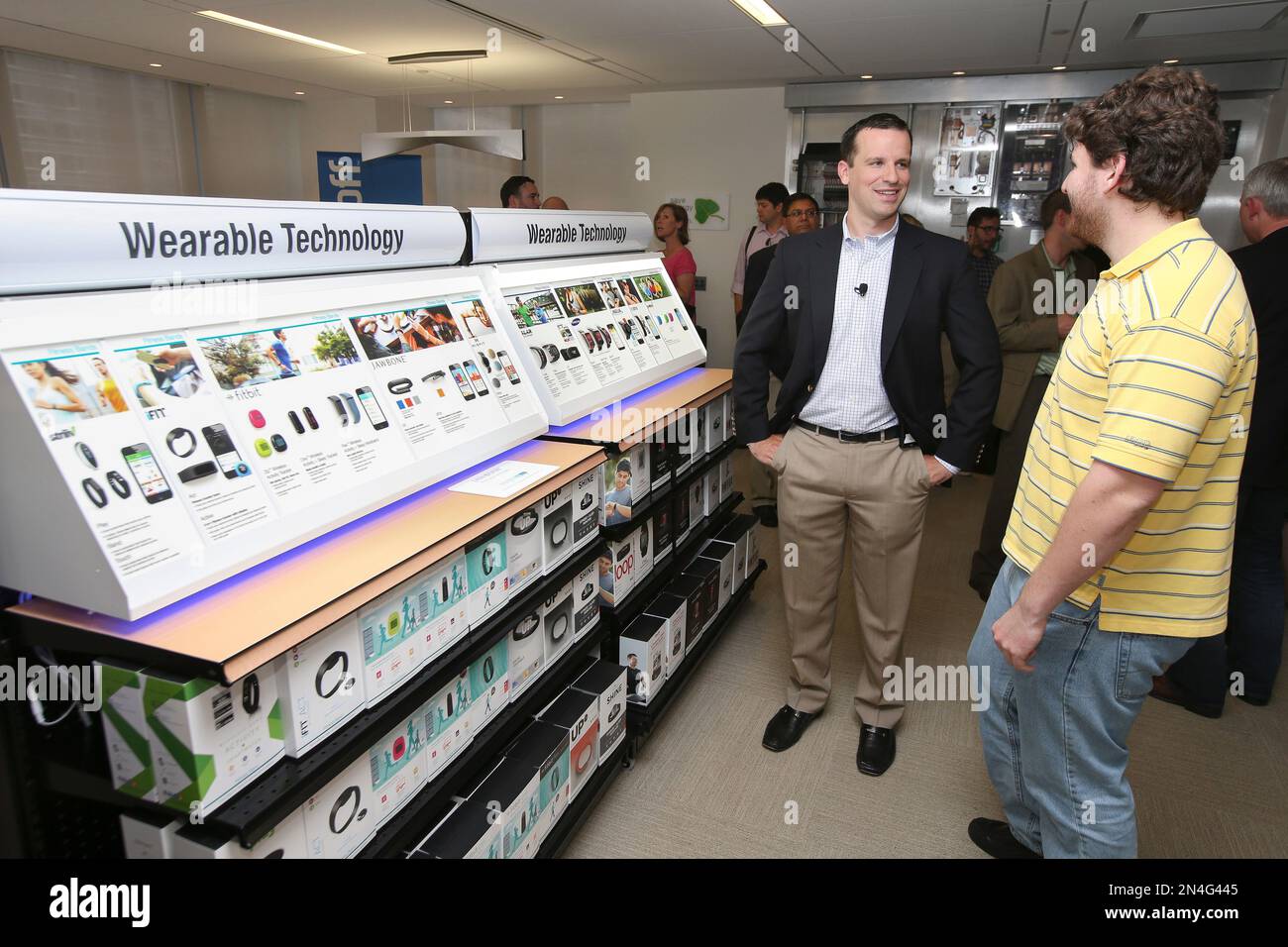 Guests mingle beside the new Staples Connect and wearable technology ...