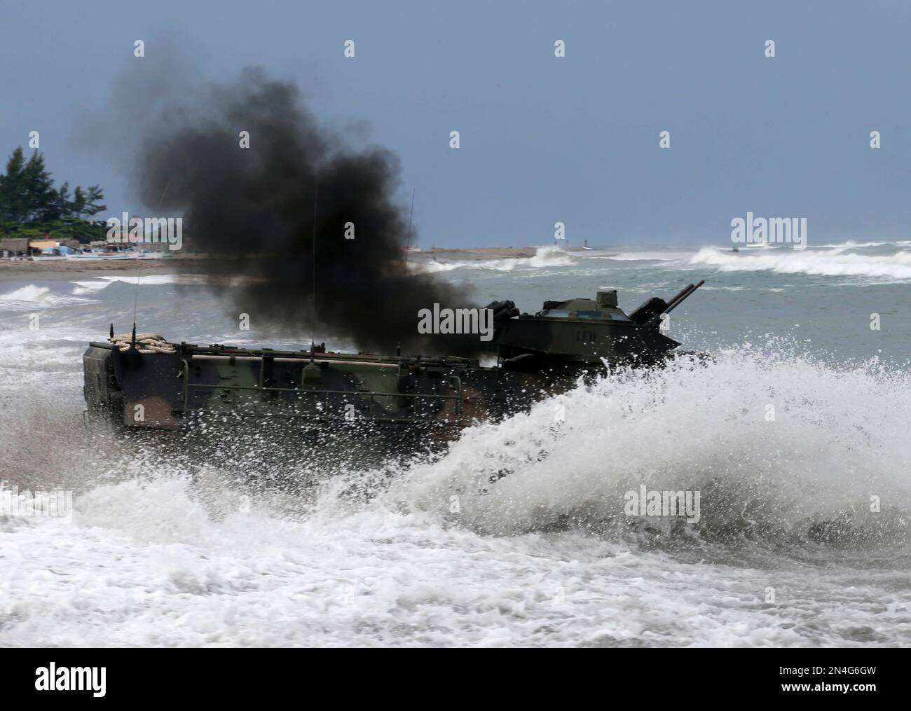 A U.S. Navy AAV (Amphibious Assault Vehicle) maneuvers in the water ...