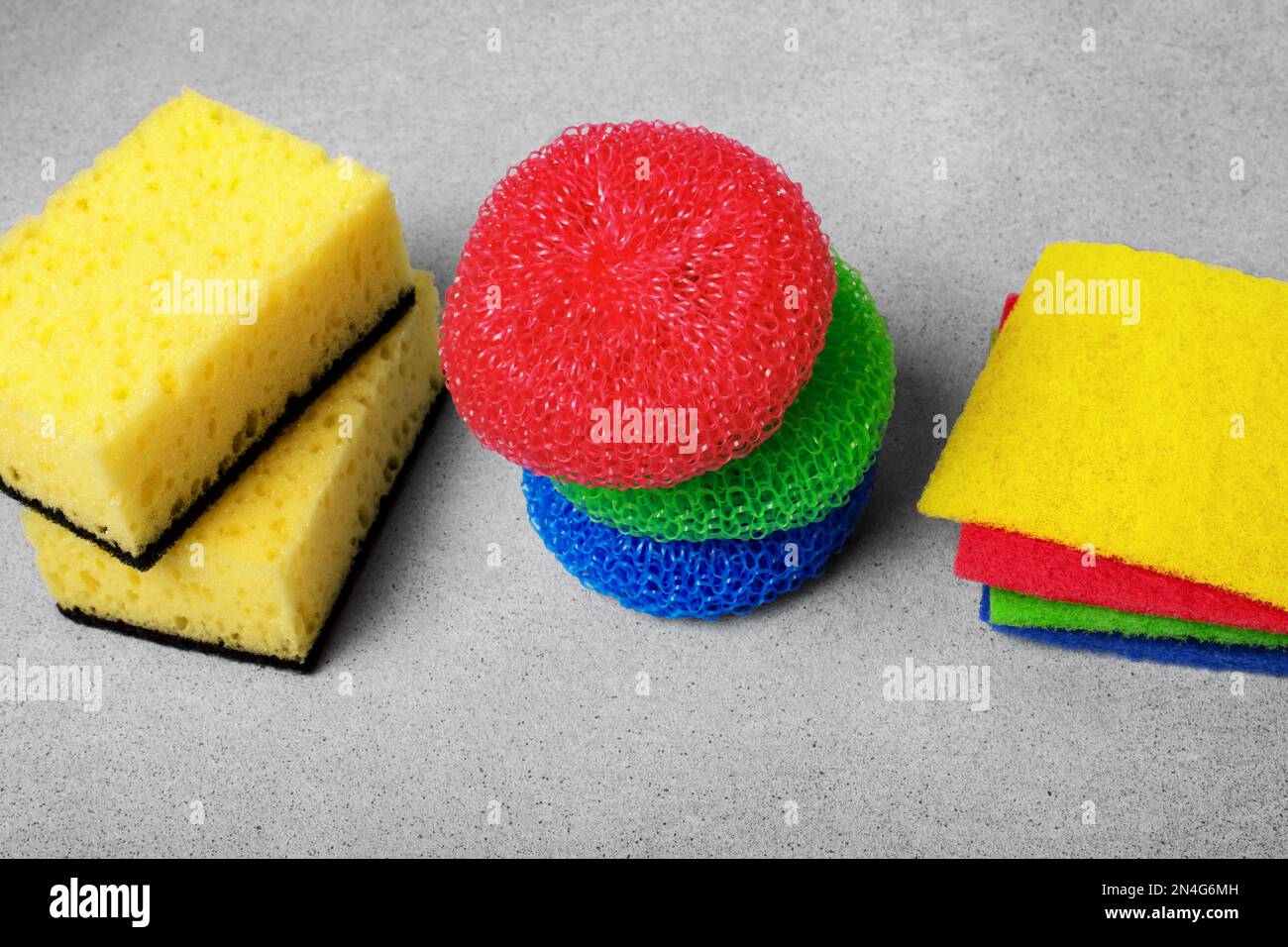 multi-colored different tipes of dishwashing sponges and napkins on ...