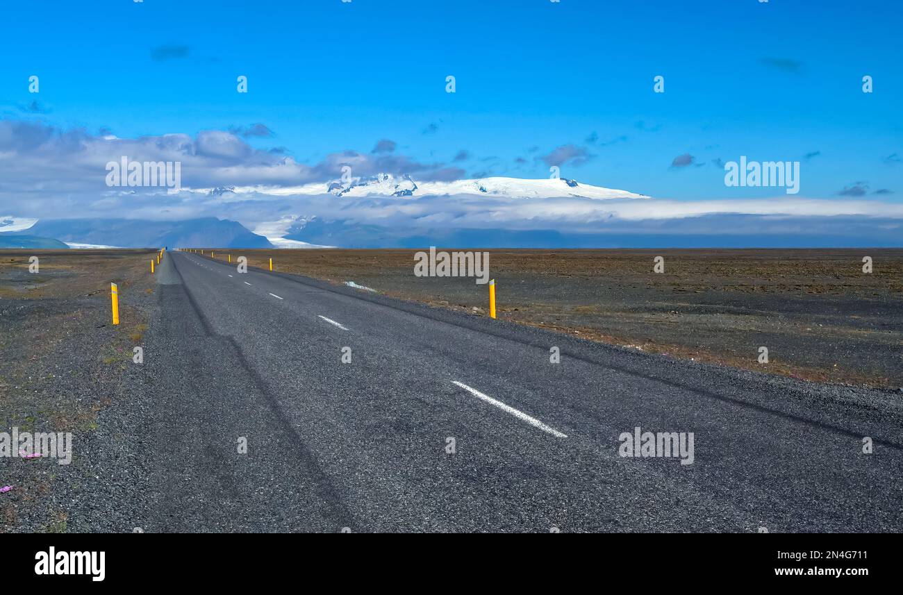 Empty endless asphalt straight road, yellow poles, dry arid wild flat ...