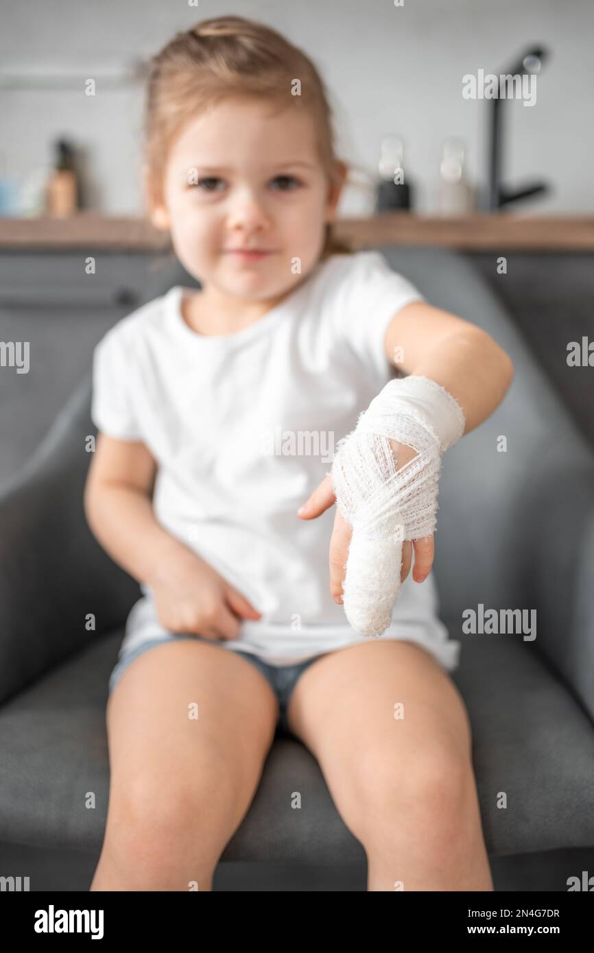 Little girl with broken finger at the doctor's appointment in the ...