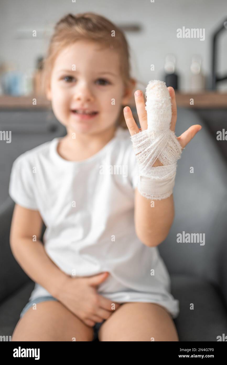 Little girl with broken finger at the doctor's appointment in the ...