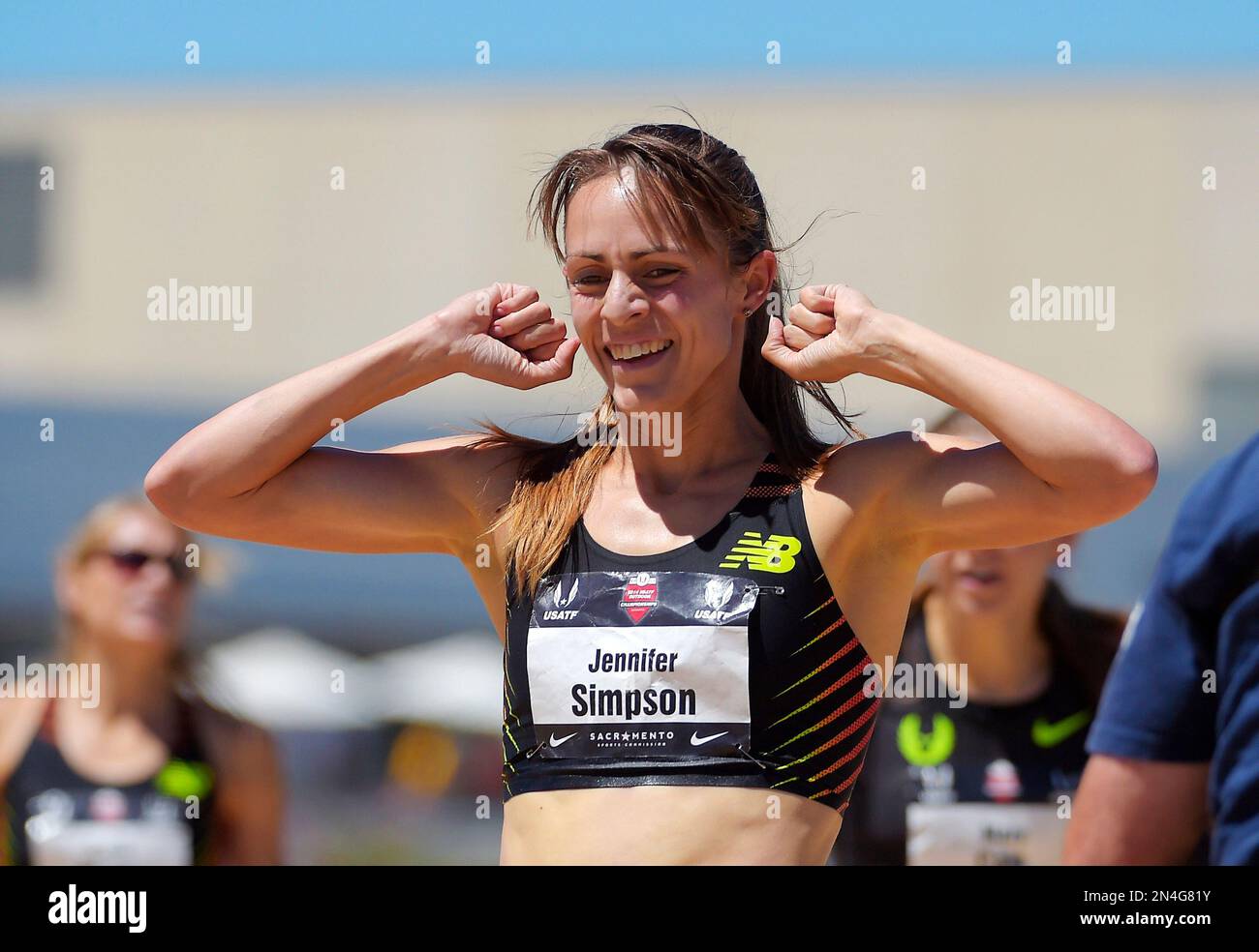 Jennifer Simpson celebrates after winning the women's 1,500-meter final ...