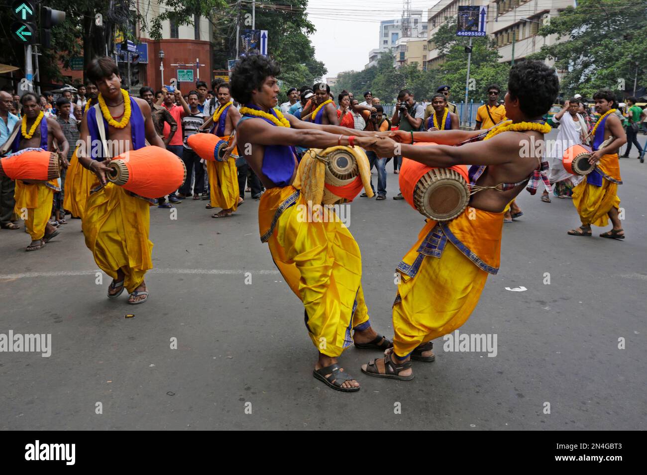 Hindu devotees with percussion instruments dance during the annual ...