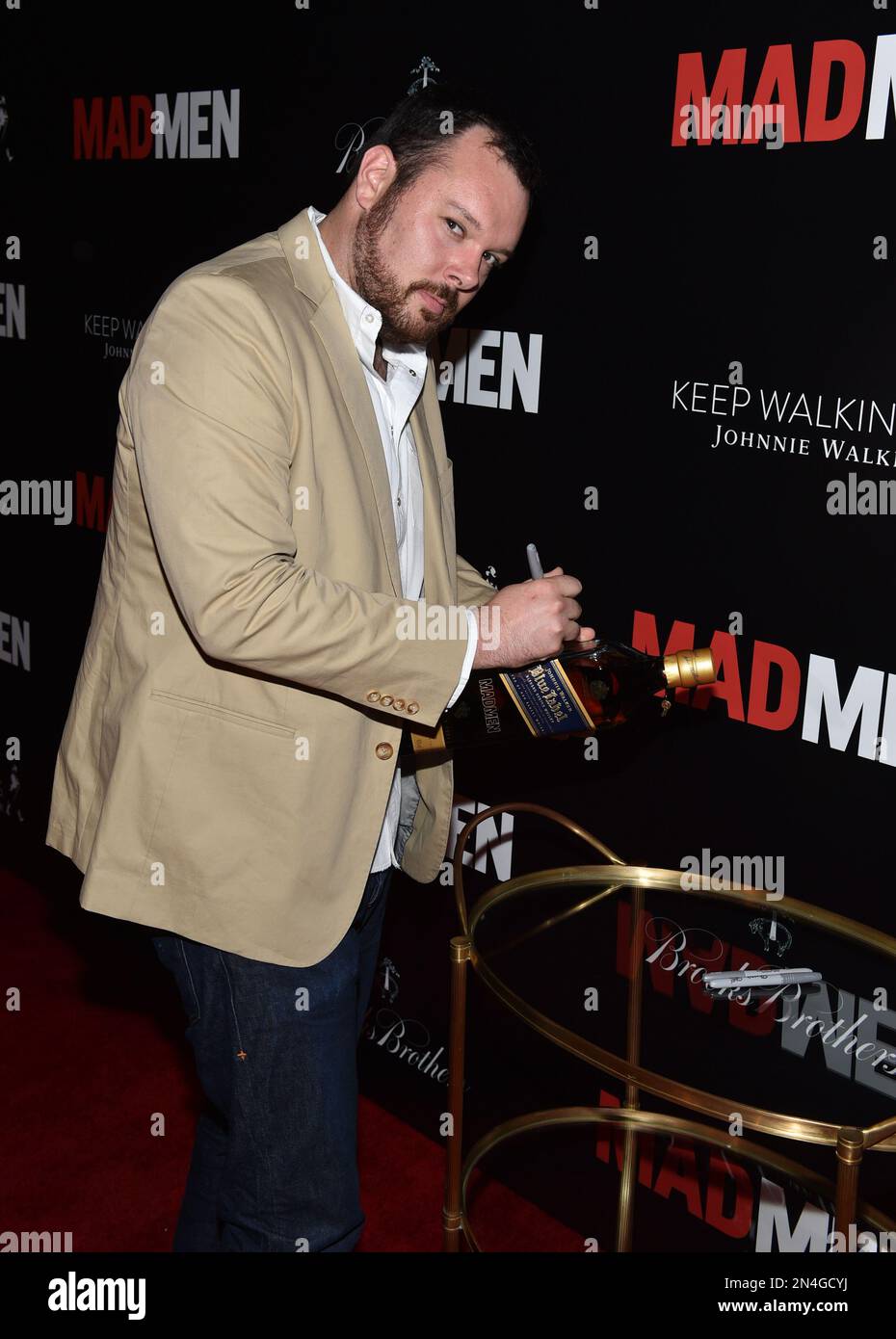 EXCLUSIVE - Michael Gladis signs a personalized bottle of Johnnie ...