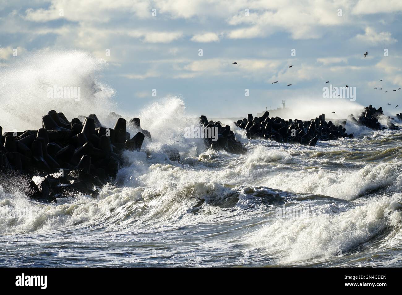 Coastal storm in the Baltic Sea, big waves crash against the concrete ...