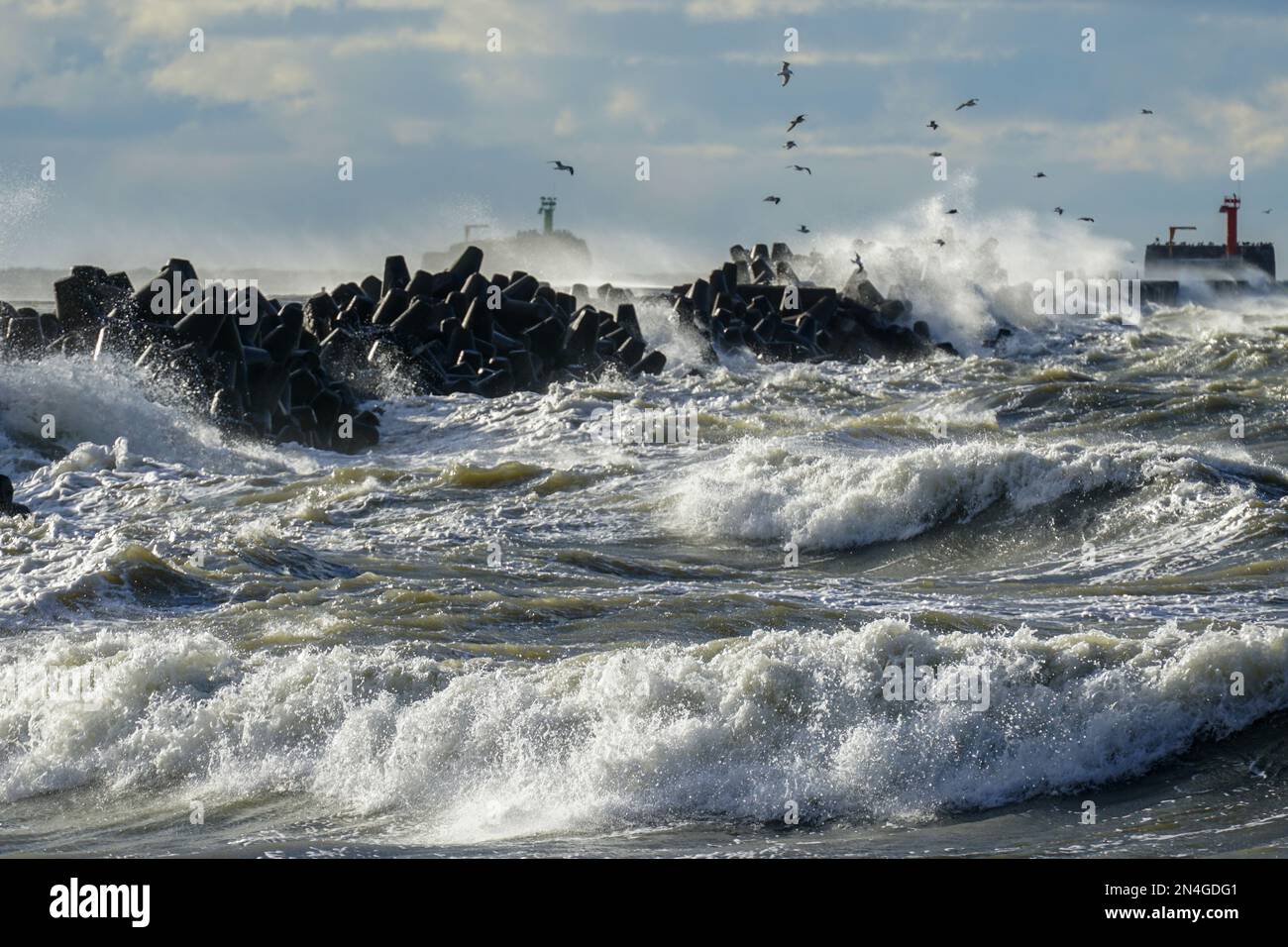 Coastal storm in the Baltic Sea, big waves crash against the concrete ...