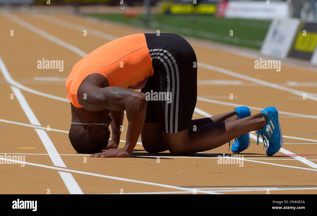 Kyle Clemons puts his head down on the track after falling at the ...