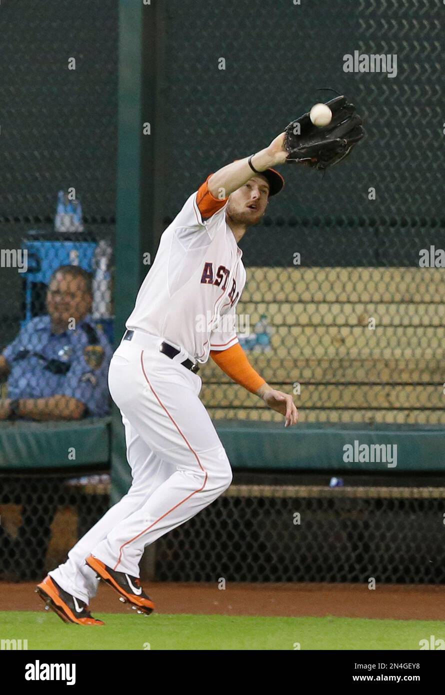 Houston Astros center fielder Alex Presley makes the catch and the out ...
