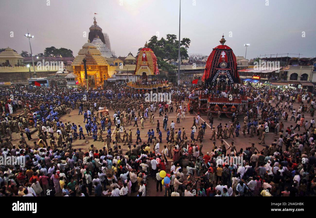 Devotees and paramilitary forces pull chariots to set in front of the ...